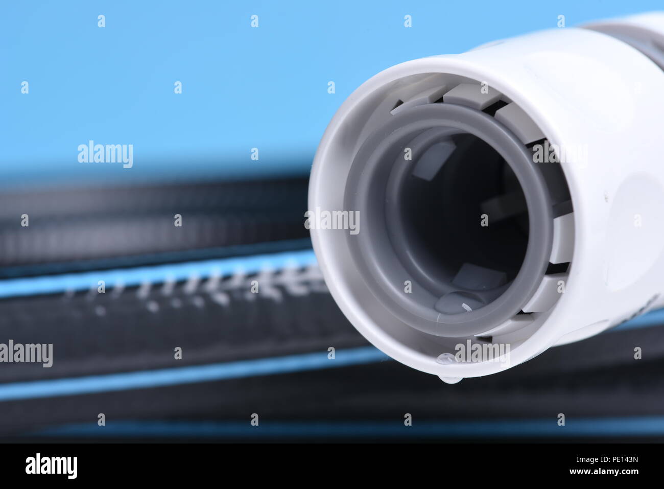 Garden water hose close up Stock Photo - Alamy