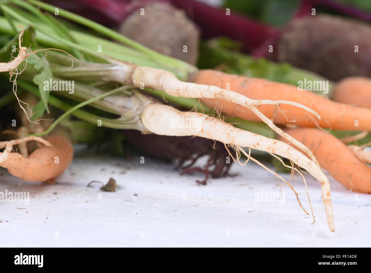 Healthy food early vegetable carrots, parsley and beet on old wooden ...