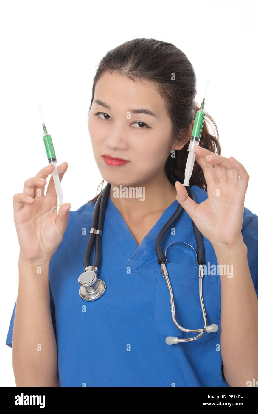 Evil Asian doctor or nurse holding a syringe filled with green ...