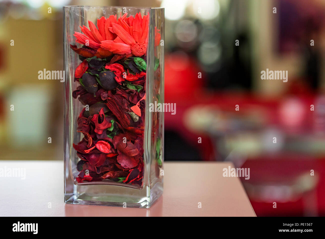 Interior glass vase with dry red plants inside Stock Photo - Alamy