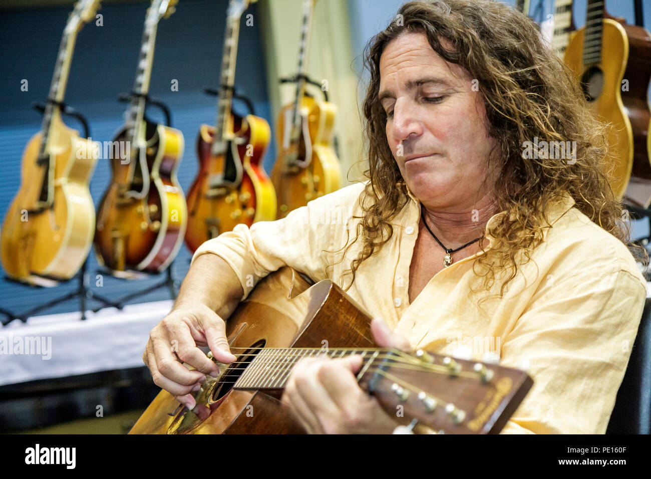 Male playing an instrument hi-res stock photography and images - Alamy