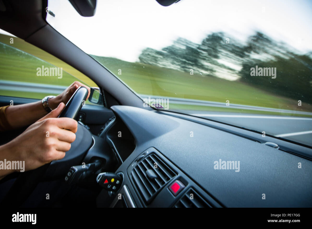 Man driving a car moving fast on a highway (motion blurred image Stock ...