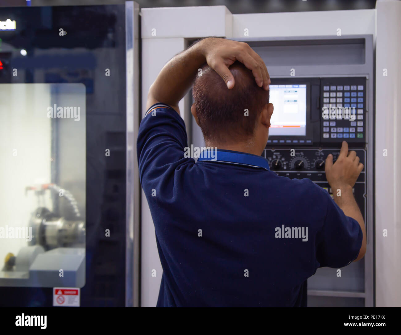Industrial worker input data programing for CNC lathing machine Stock ...
