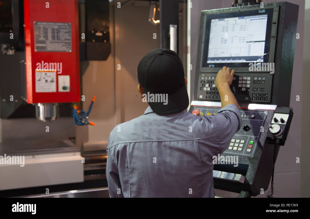 Industrial worker input data programing for CNC milling machine Stock ...