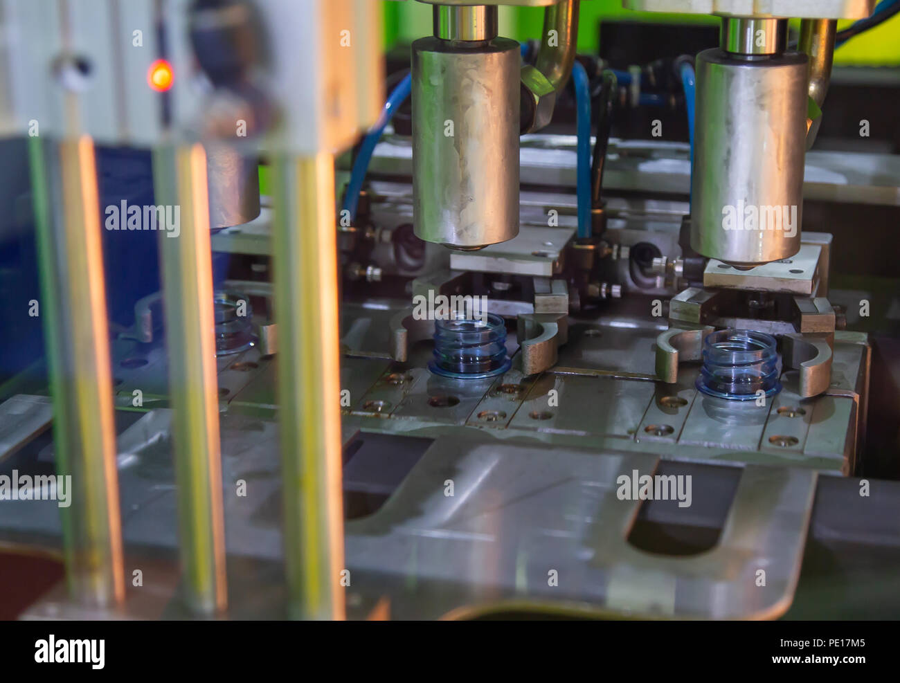 Process of PET plastic bottle on plastic Bottle blowing machine Stock ...