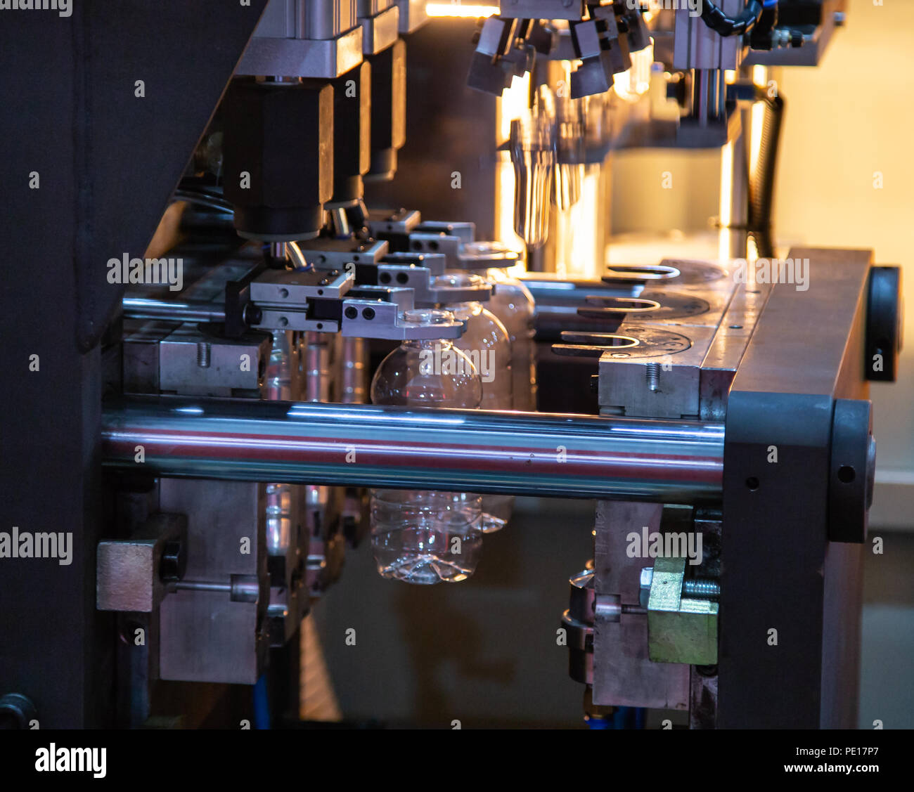 Process of PET plastic bottle on plastic Bottle blowing machine Stock ...