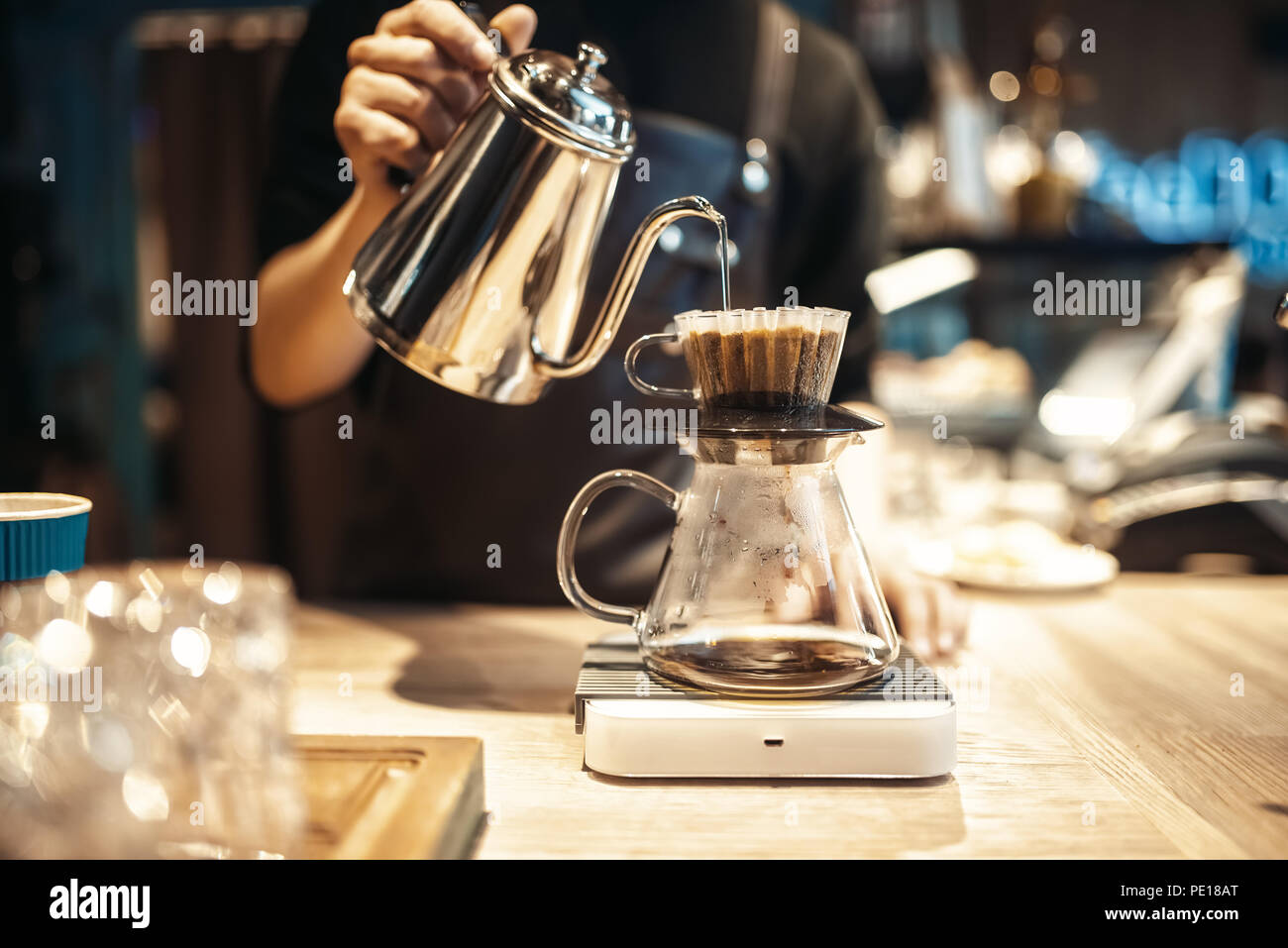 Male waiter pouring water hi-res stock photography and images - Alamy