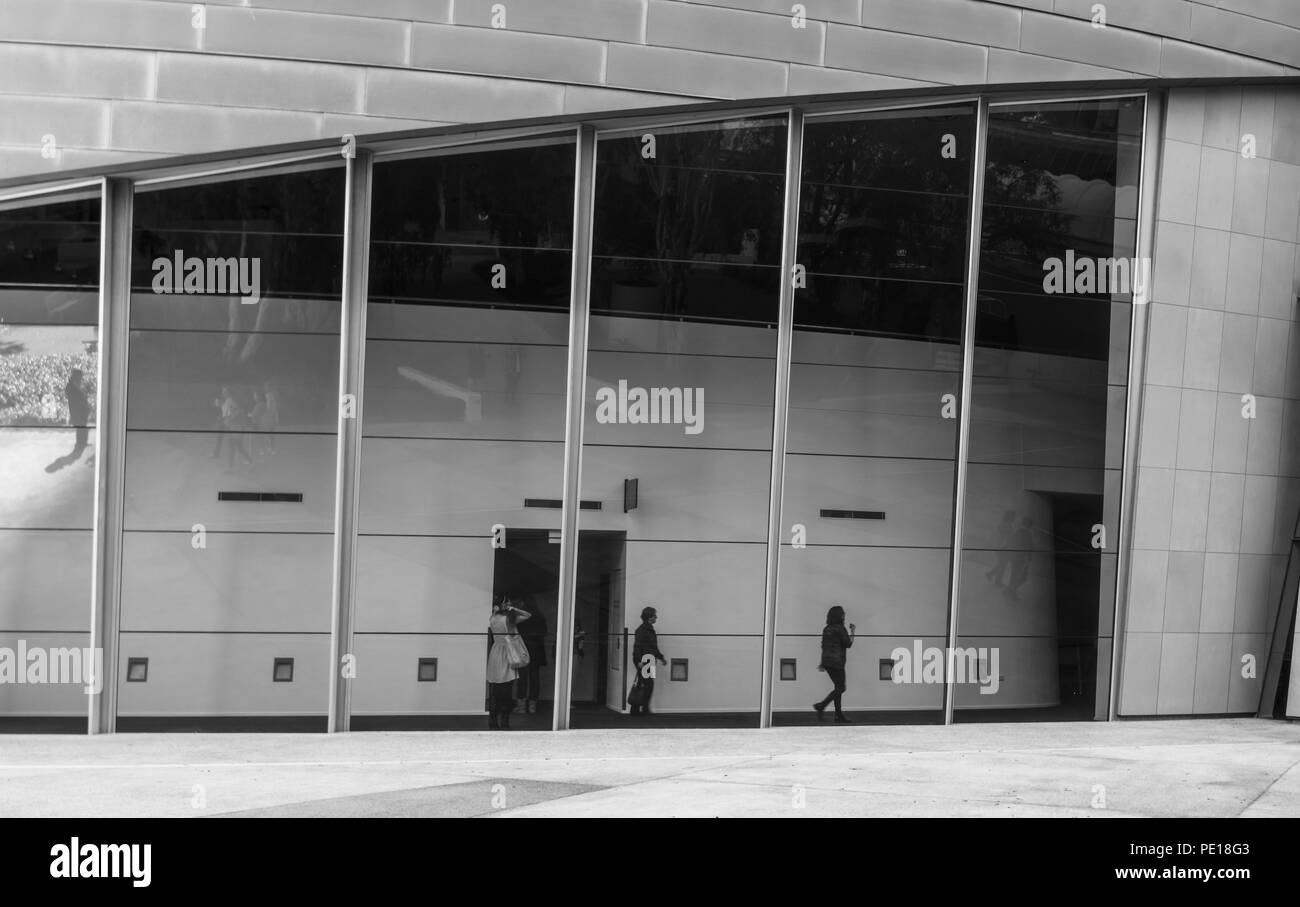 Black and White photo showing visitors behind a large glass window at ...