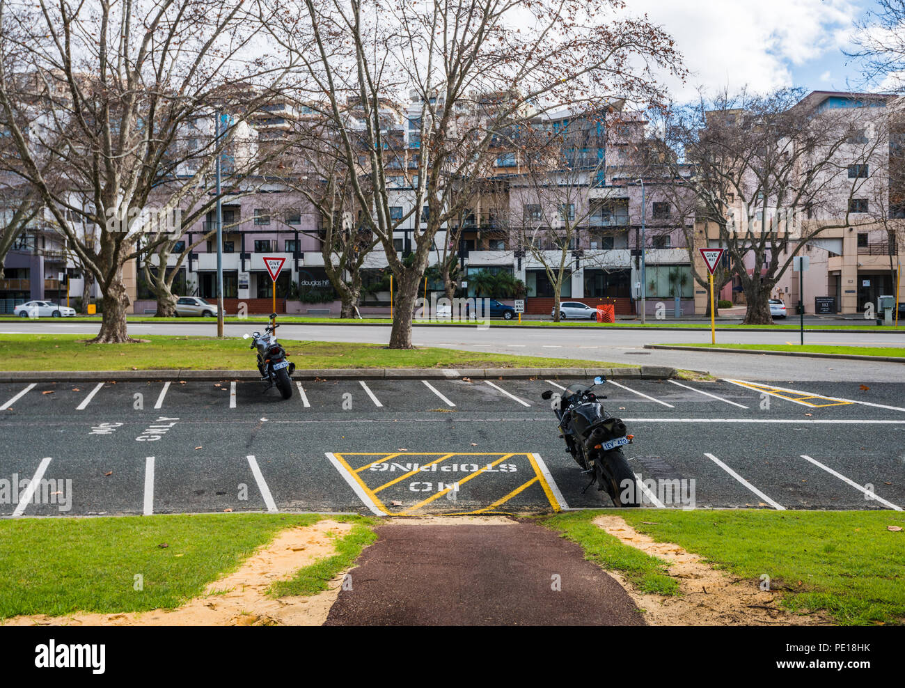 two parking motorcycles on a parking lot, parking space in Perth ...