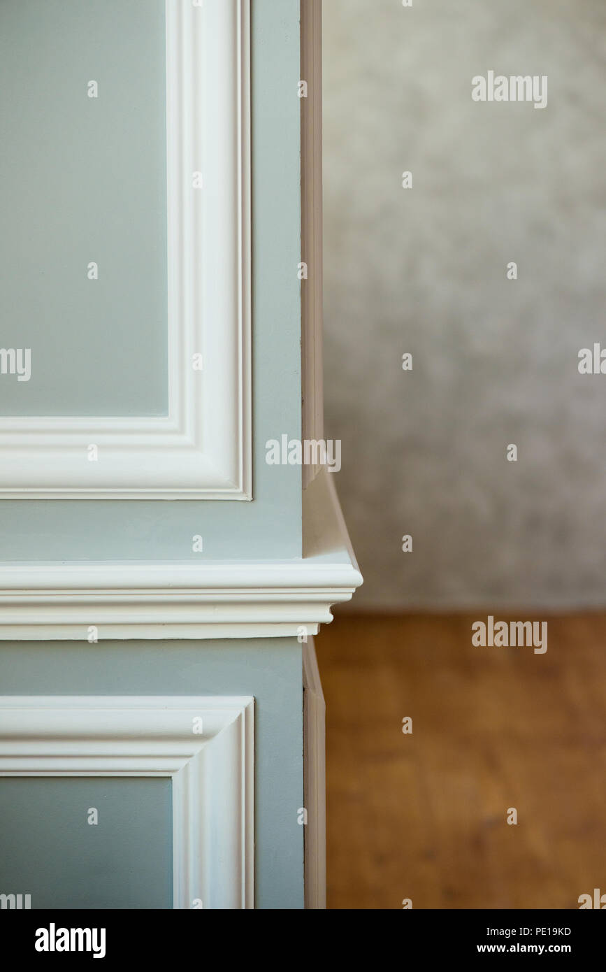 Gray column with white molding. Texturized grey putty. Vintage or ...