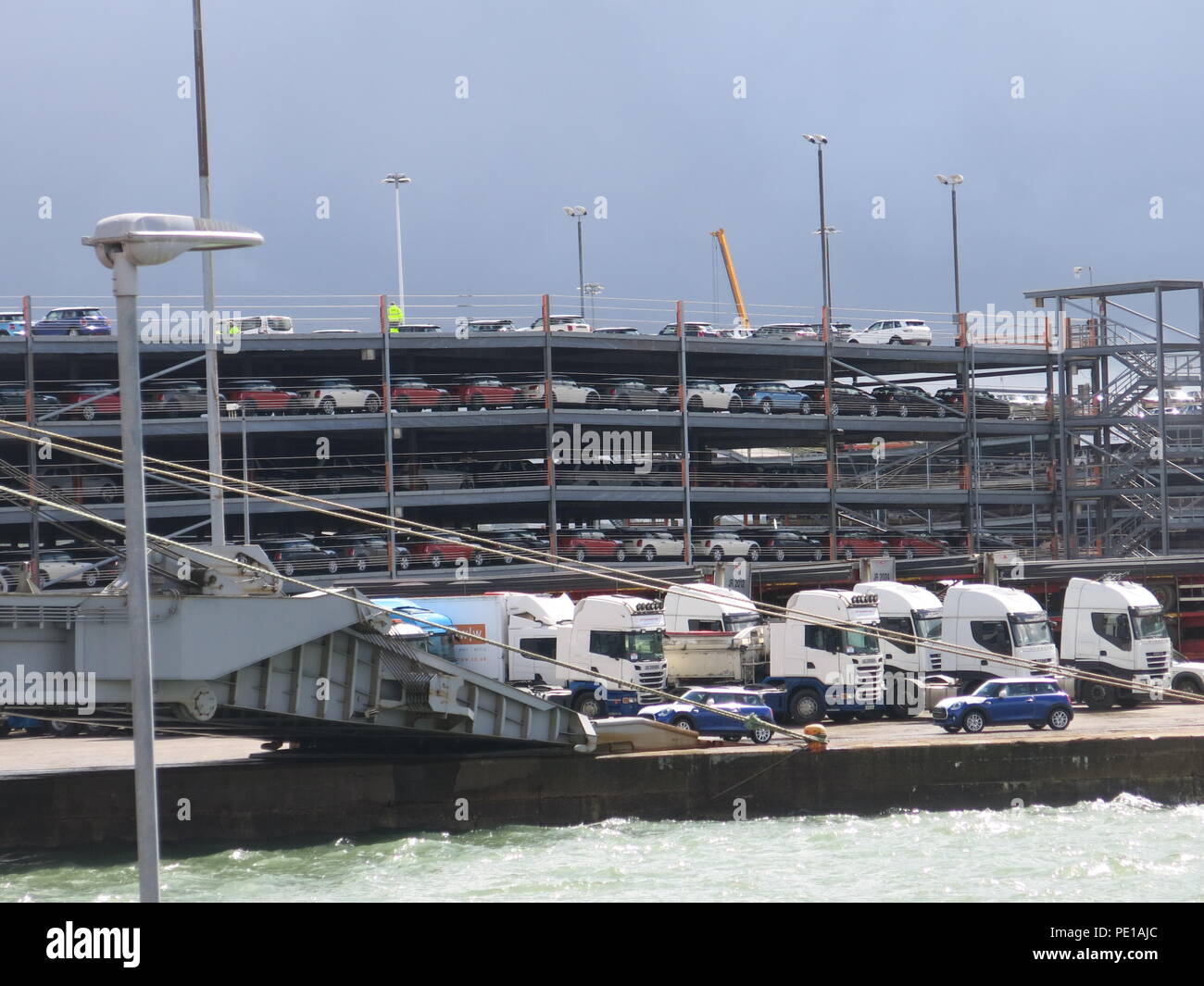New BMW minis for export are driven from the quayside onboard a large ...