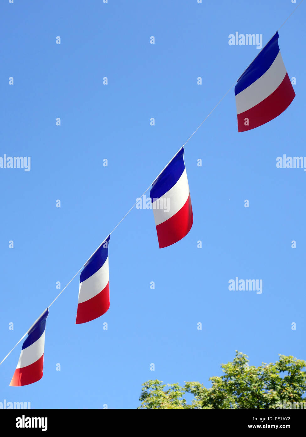 French String Flag Banners in rows floating in a summer blue sky in ...