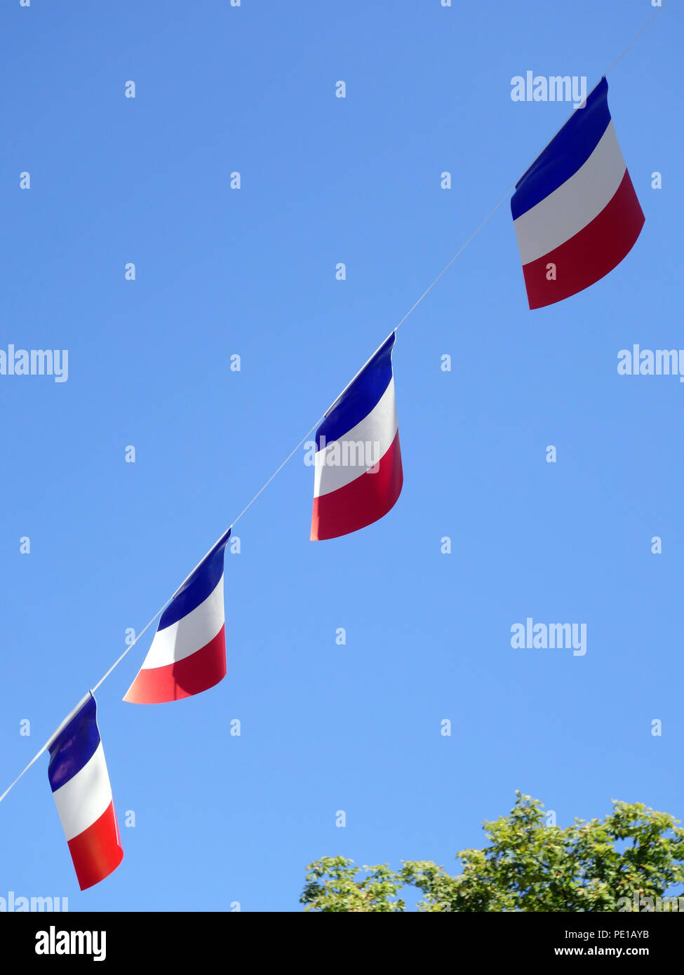 French String Flag Banners in rows floating in a summer blue sky in ...