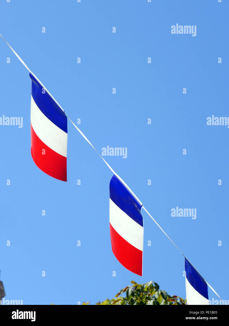 French String Flag Banners in rows floating in a summer blue sky in ...