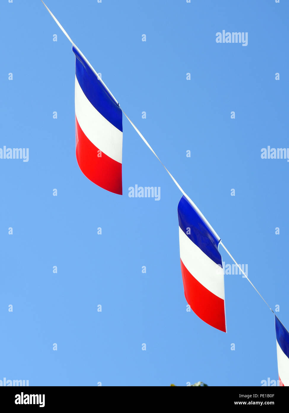 French String Flag Banners in rows floating in a summer blue sky in ...