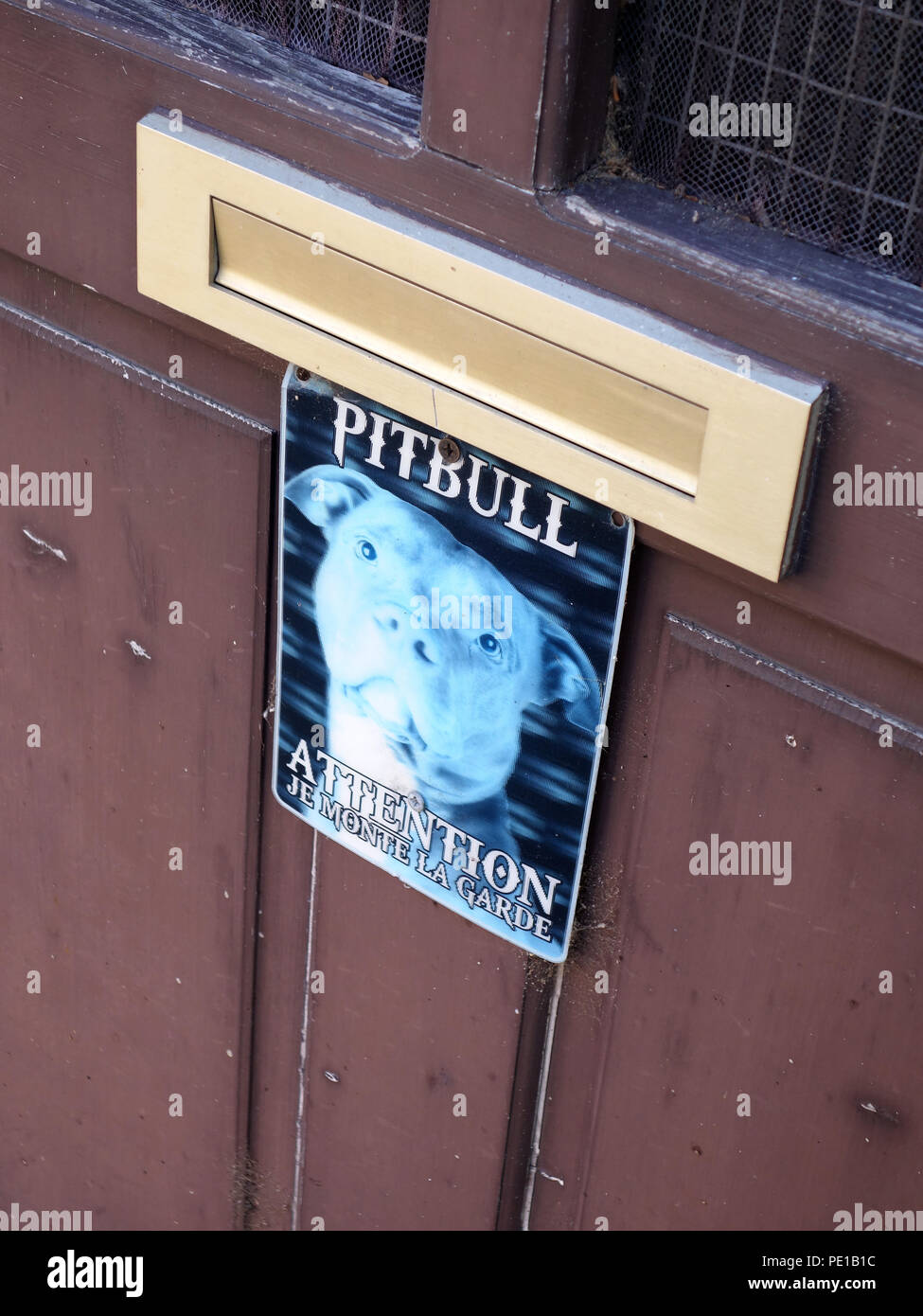 Beware of the pitbull warning sign on a house door in Cessenon-sur-Orb ...