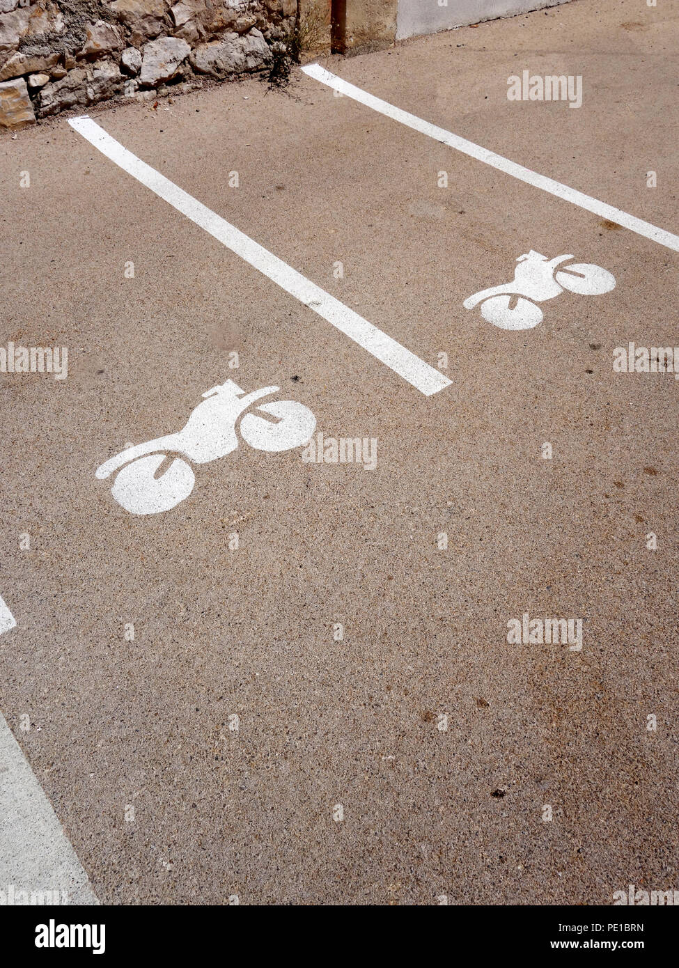 Motocycle parking booth spaces marked on the carpark floor in Cessenon ...