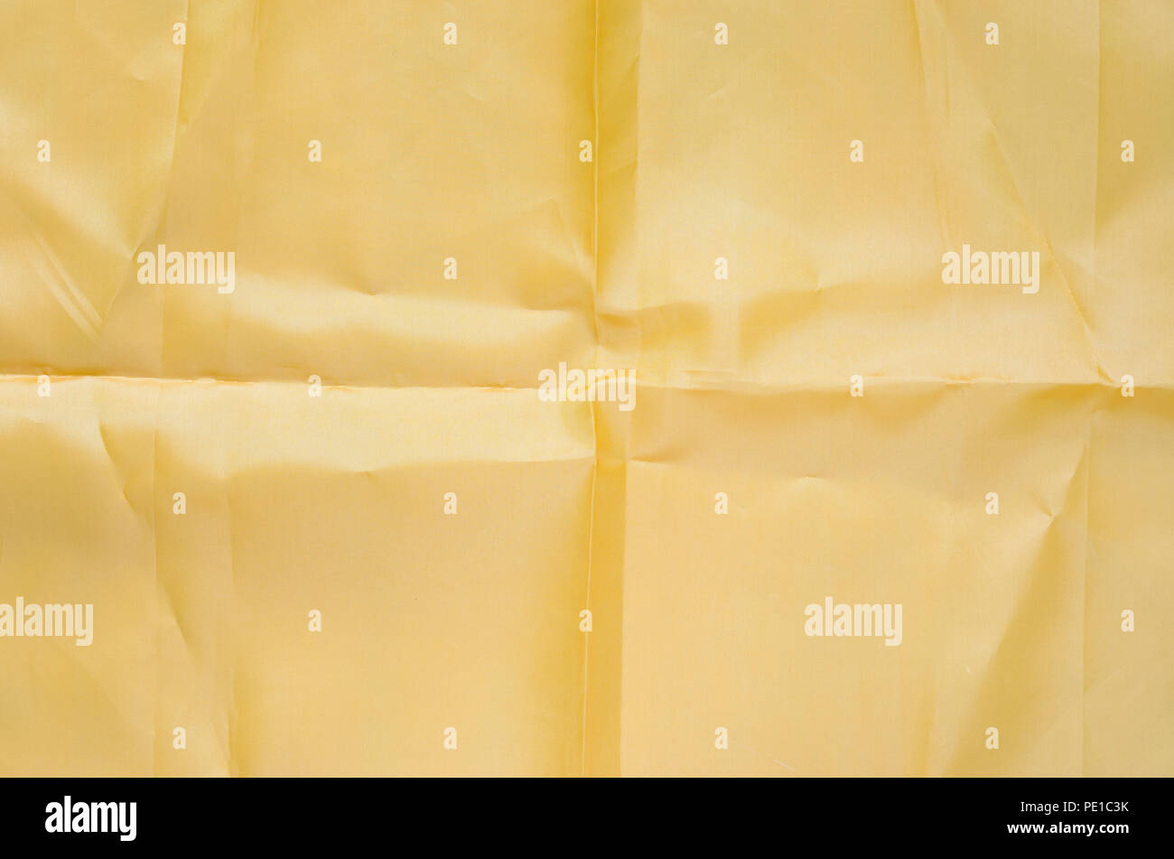 Yellow Synthetic Lining Fabric with Folds. Crumpled Sheet or Clothes ...