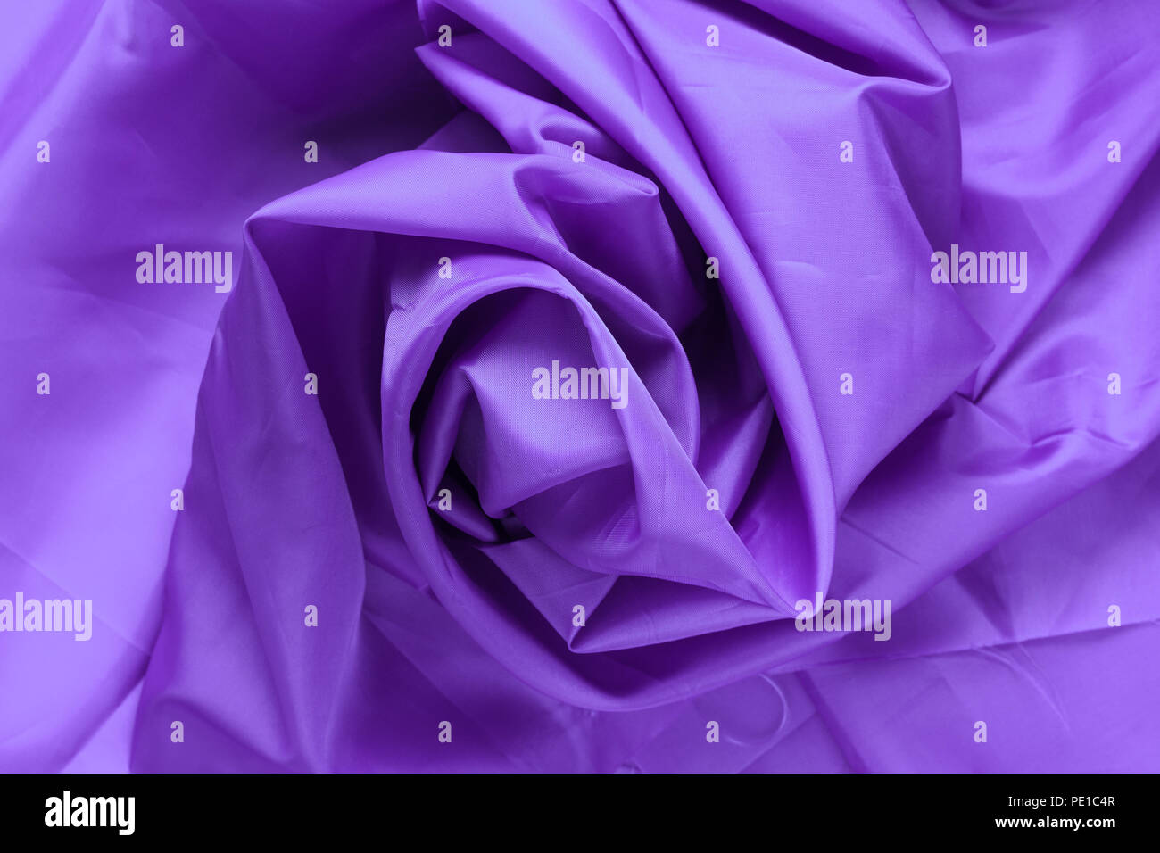 Purple Synthetic Lining Fabric with Folds. Crumpled Sheet or Clothes ...
