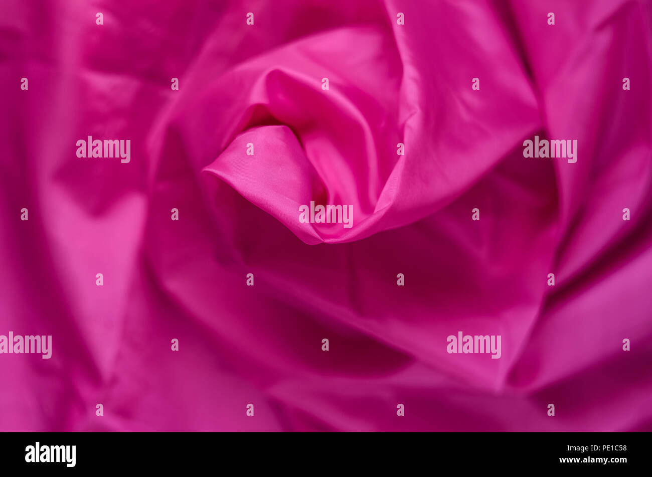 Pink Synthetic Lining Fabric with Folds. Crumpled Sheet or Clothes ...