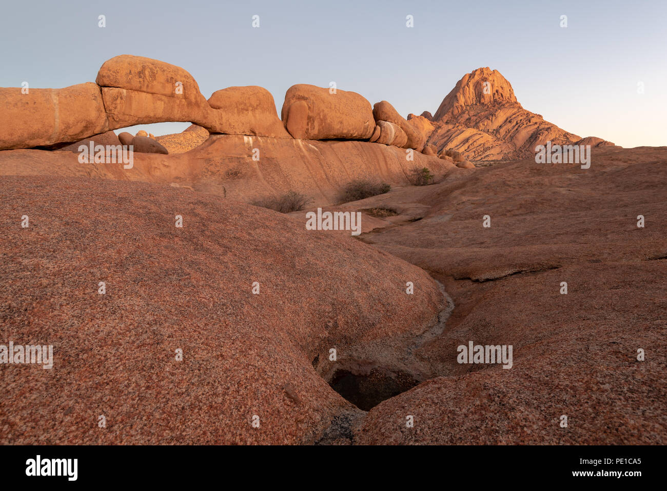 Spitzkoppe massive rock arch bridge at sunrise, Namibia Stock Photo - Alamy