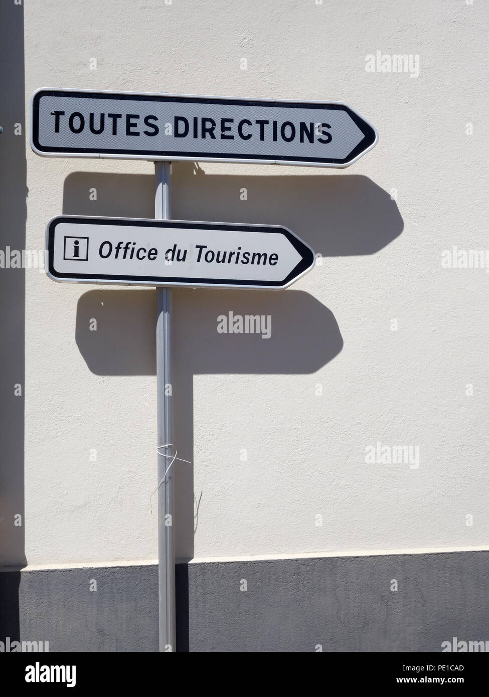 Road direction signs in the small village of Cessenon-sur-Orb, France ...
