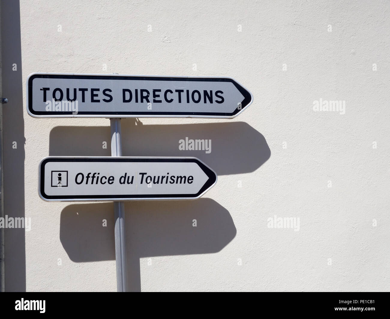 Road direction signs in the small village of Cessenon-sur-Orb, France ...
