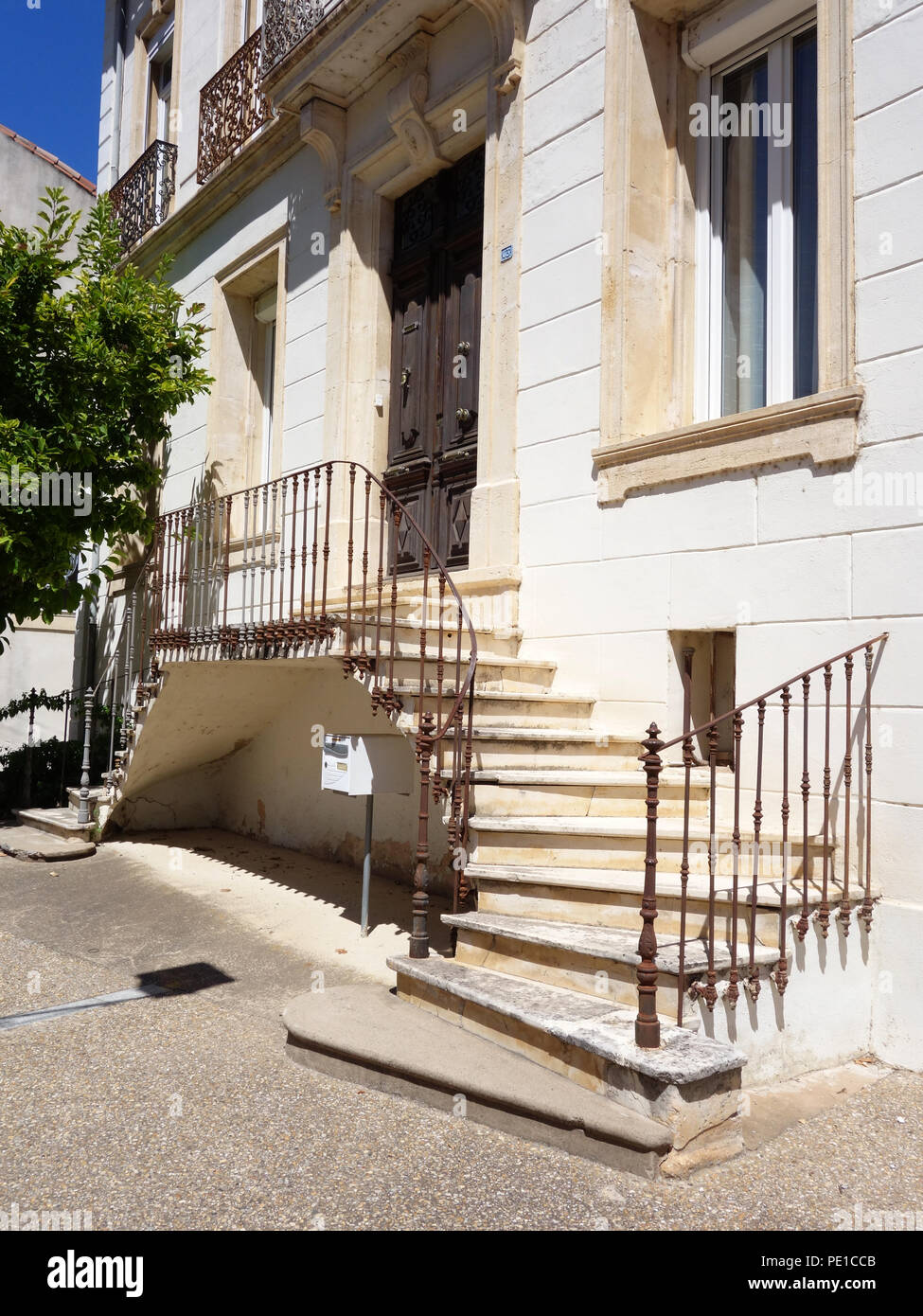Pretty steps leading two ways up to the house front door exterior of an ...