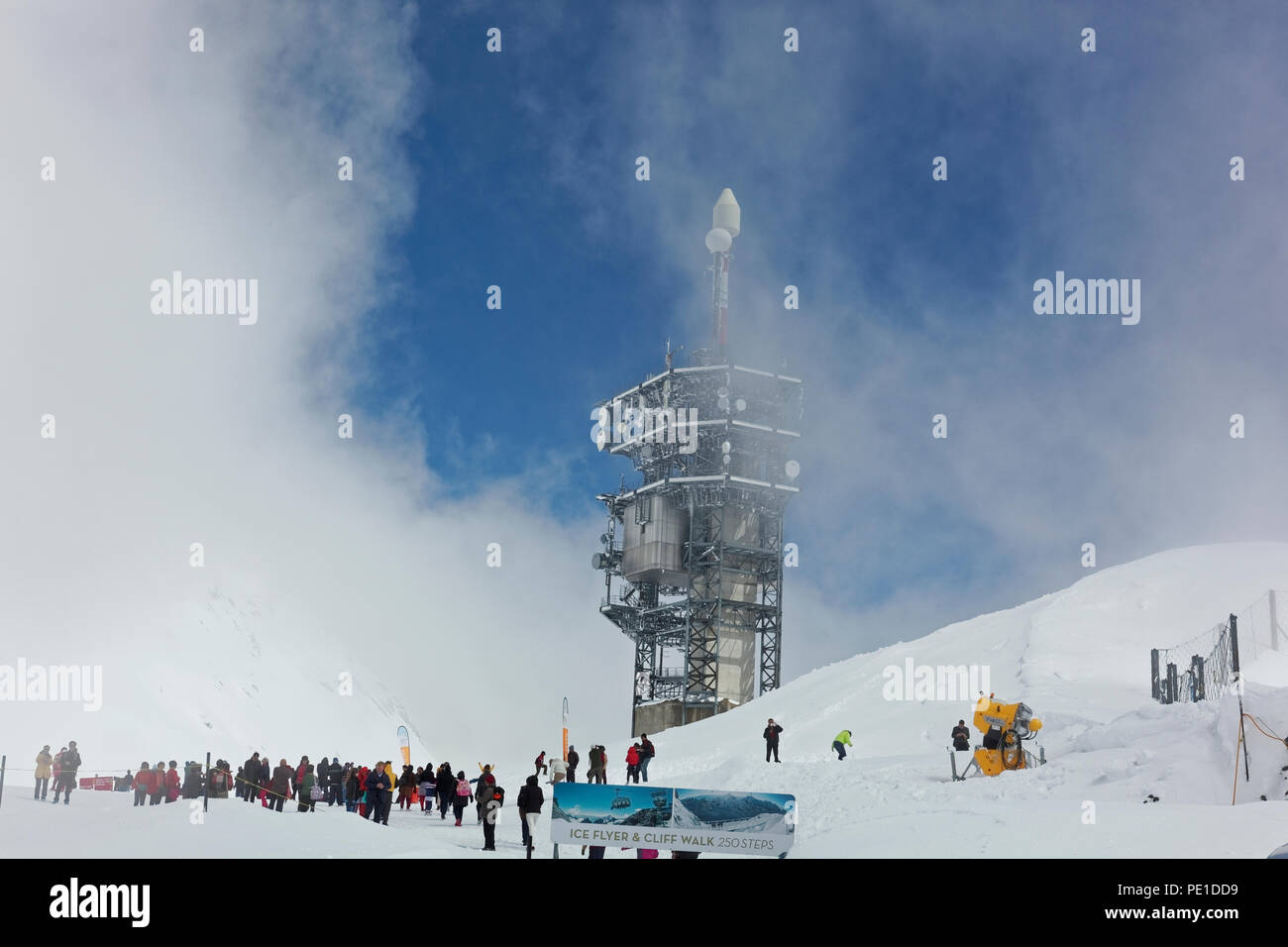 Tourist enjoying the view at the mount Titlis peak and surroundings ...
