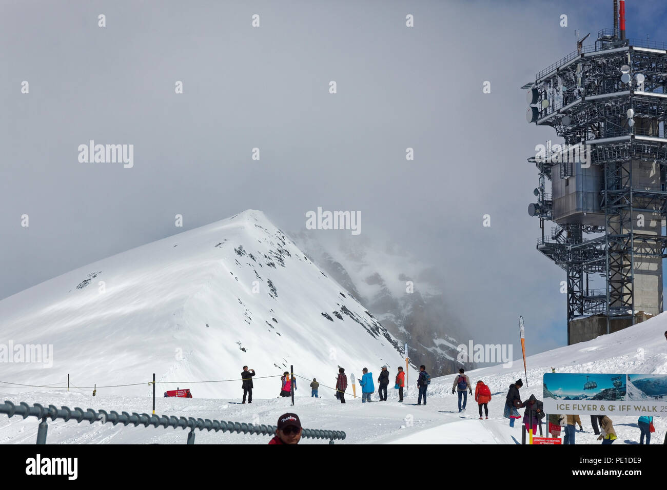 Tourist enjoying the view at the mount Titlis peak and surroundings ...