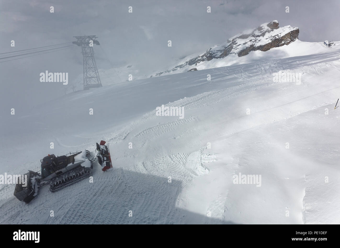 View of area surrounding the mount Titlis, in foggy misty weather ...