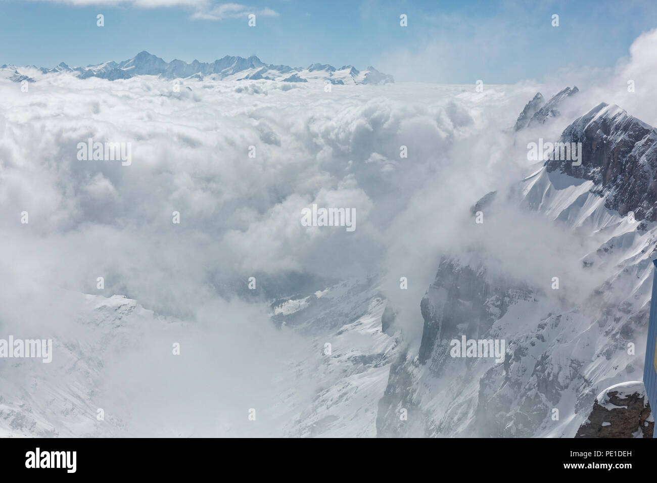 View of area surrounding the mount Titlis, in foggy misty weather ...