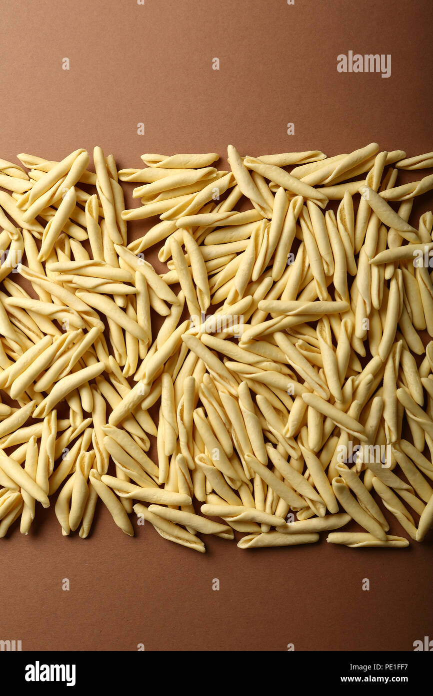 Italian pasta flat lay brown background Stock Photo - Alamy