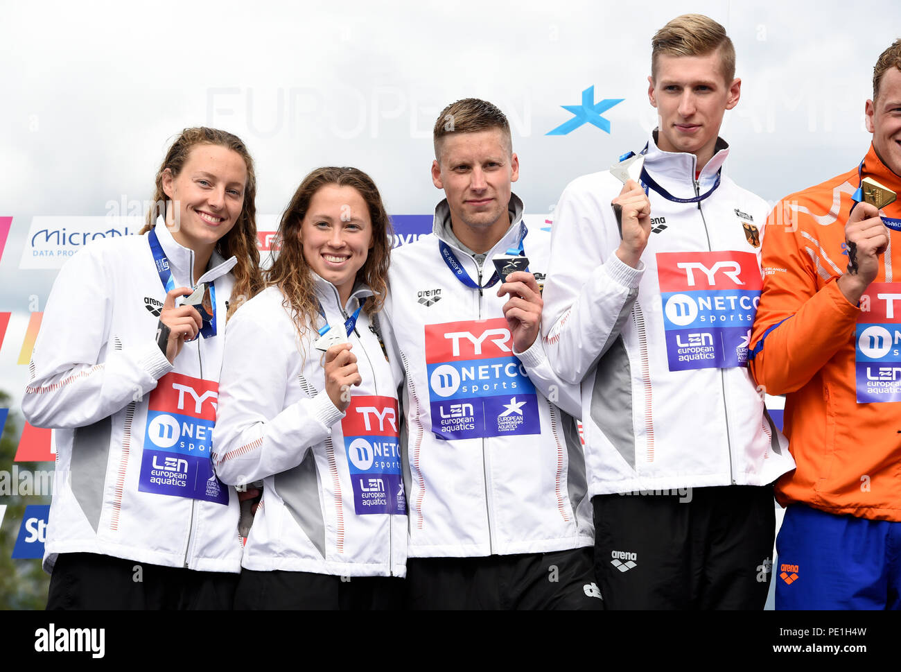 The German team celebrate winning Silver in the Open Water Swimming ...