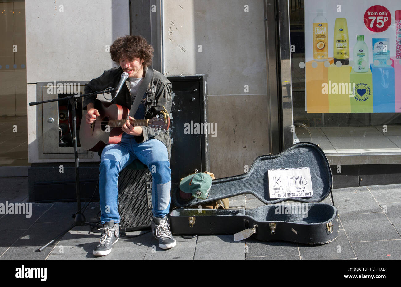 Ike Thomass: Musical guitar playing buskers with case for donations on ...