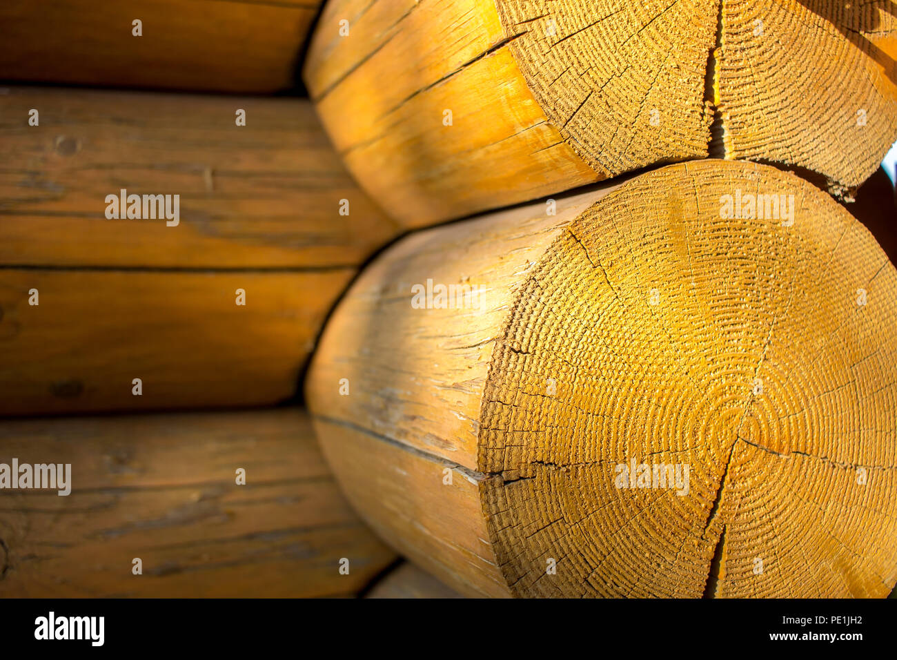 Round wooden logs blockhouse with sunbeam closeup background Stock ...
