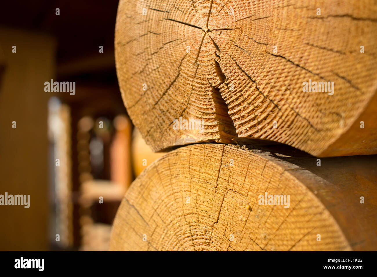Closeup wooden log house background with blur Stock Photo - Alamy