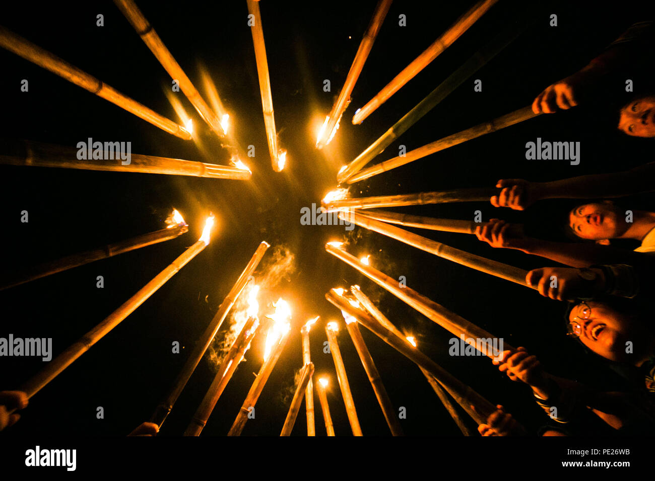 Group of people with torches hi-res stock photography and images - Alamy