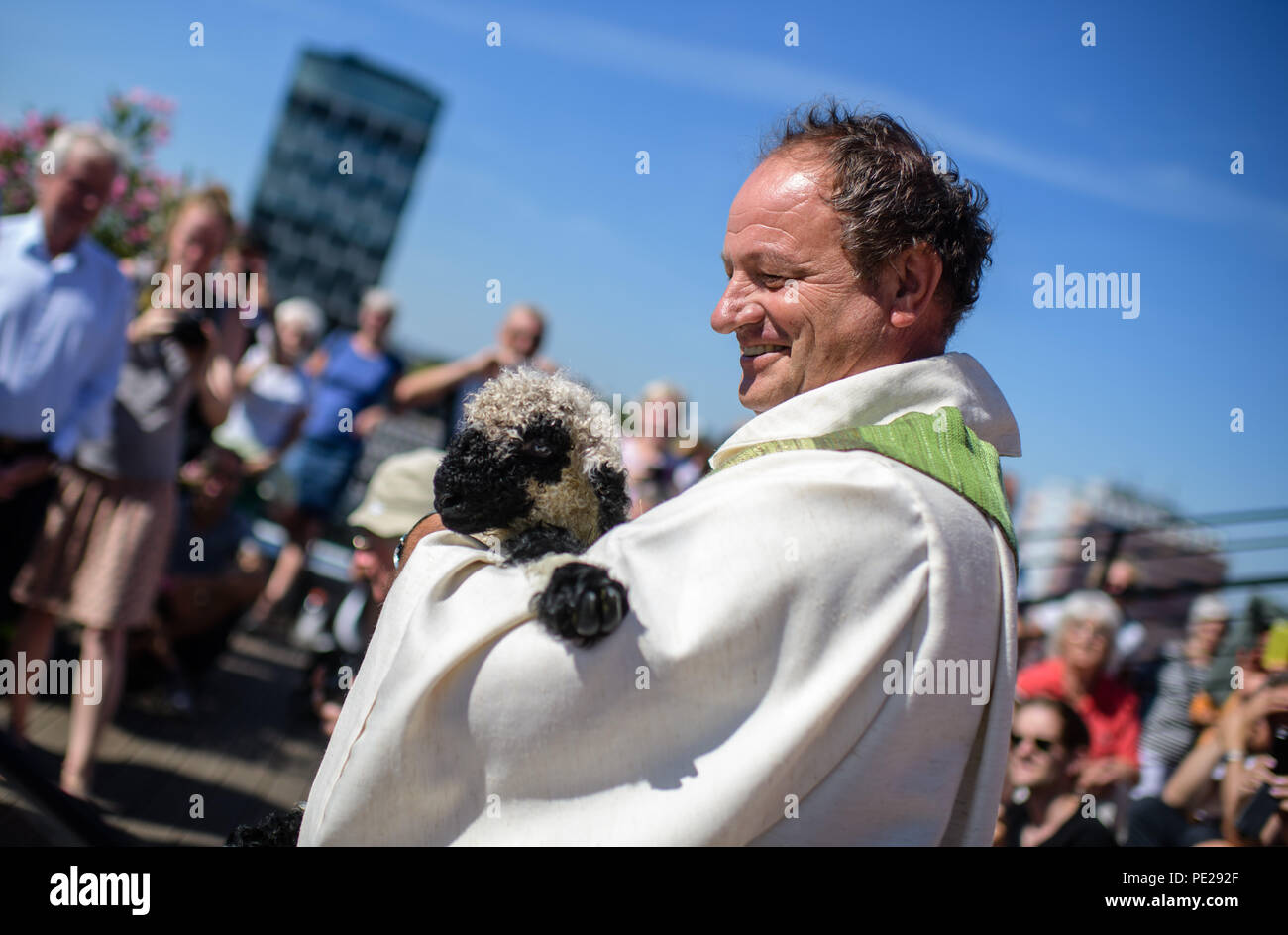 Munich, Germany. 12th Aug, 2018. Father Rainer Maria Schiessler holds a ...
