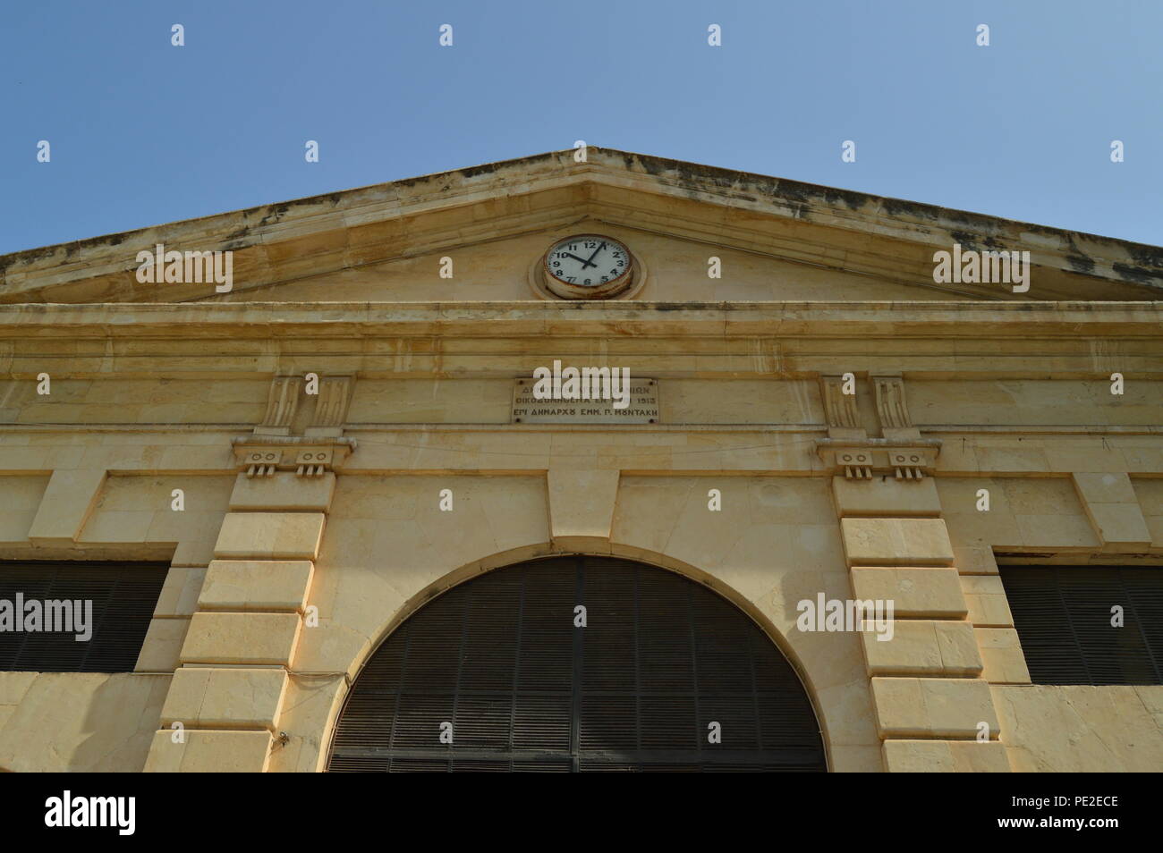 Facade Of The Beautiful Market Of Chania With Its Beautiful Clock In ...