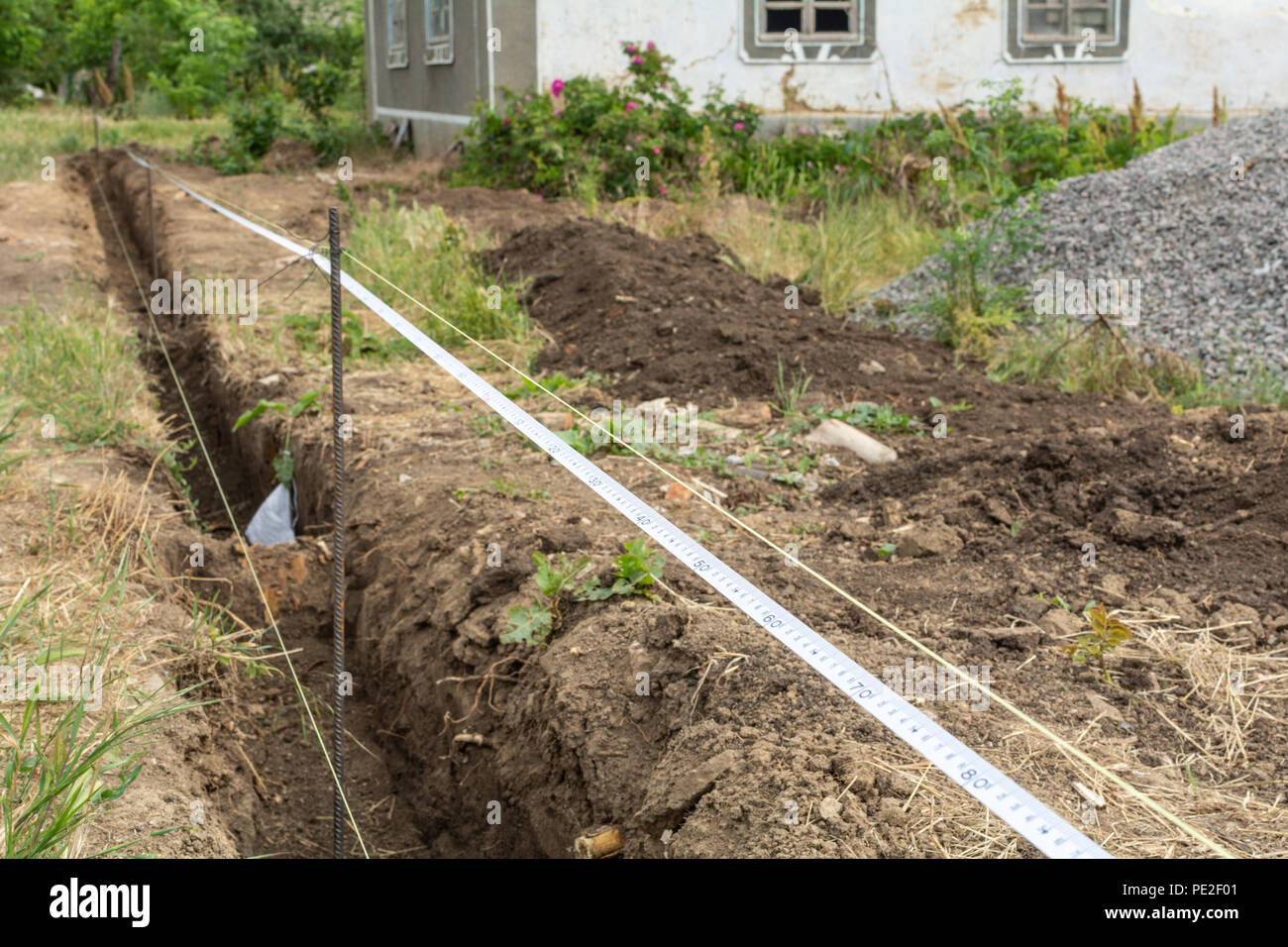 Construction of a fence. Layout of the foundation for the fence Stock ...