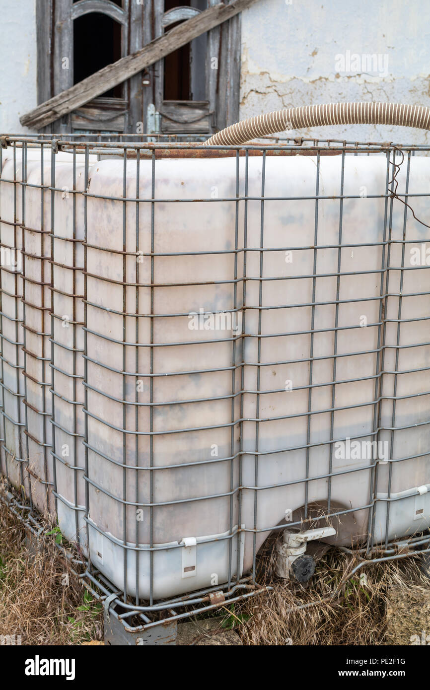 Plastic water tank. Imported water for construction Stock Photo - Alamy