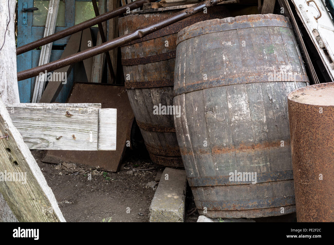 Old wooden barrels for wine in the backyard Stock Photo - Alamy