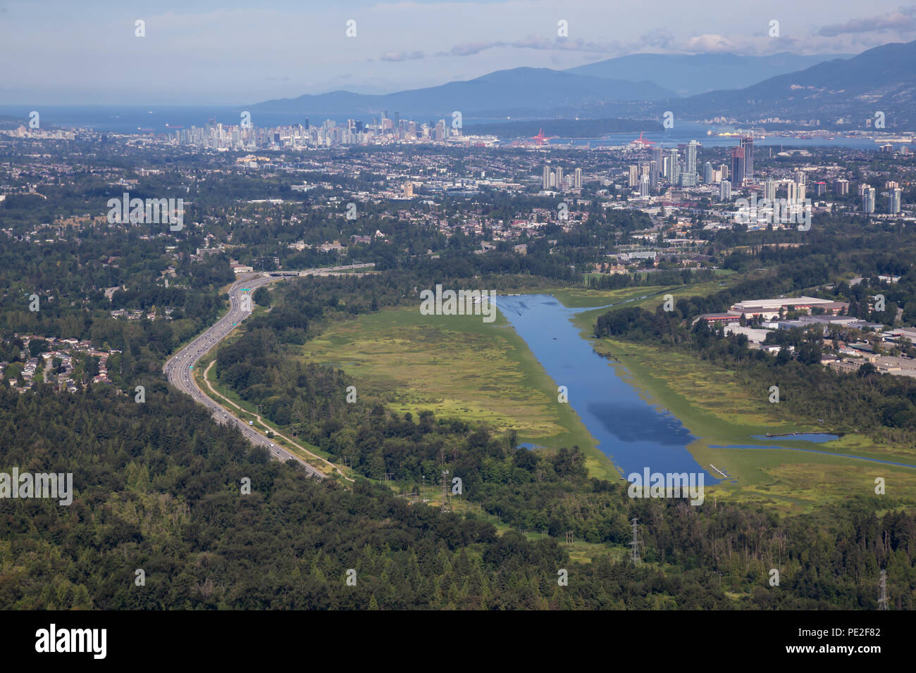 Aerial view of Burnaby Lake in the City with Downtown in the background ...
