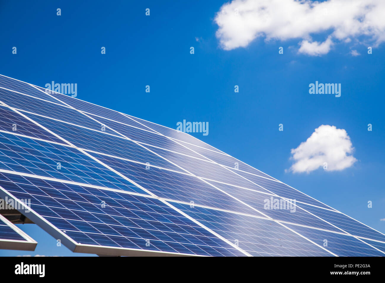 Close-up of photovoltaic panel with the reflection of a blue sky with ...