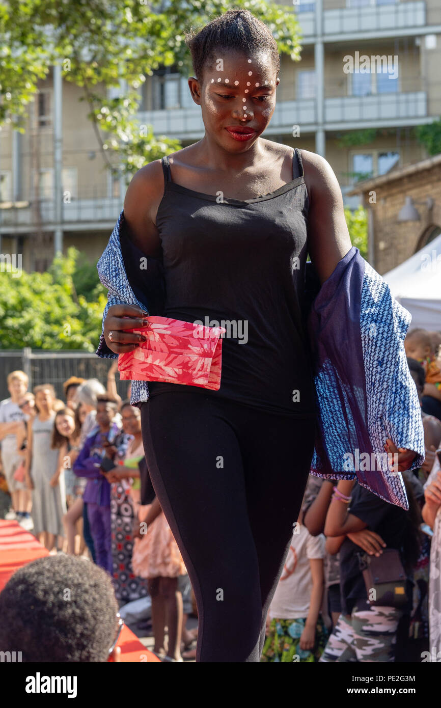 Female model of African origin showing African fashion on the catwalk ...