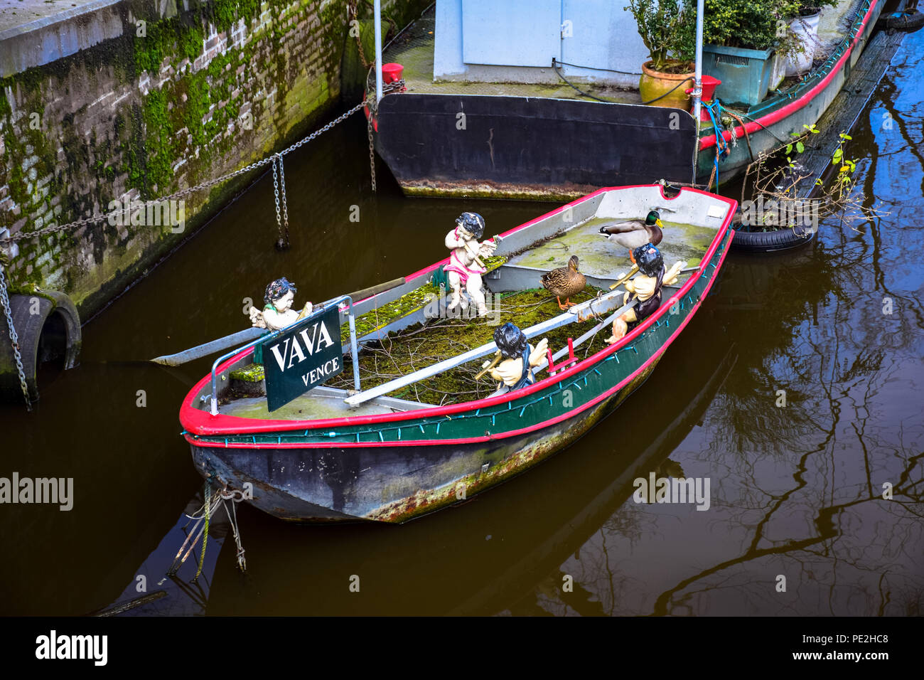 Small boat on a canal in the center of Amsterdam, Netherlands Stock ...