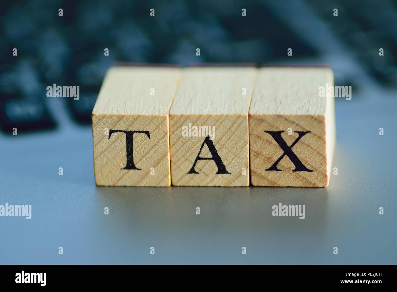 Illustration Financial terms written on wooden blocks with blurred note ...