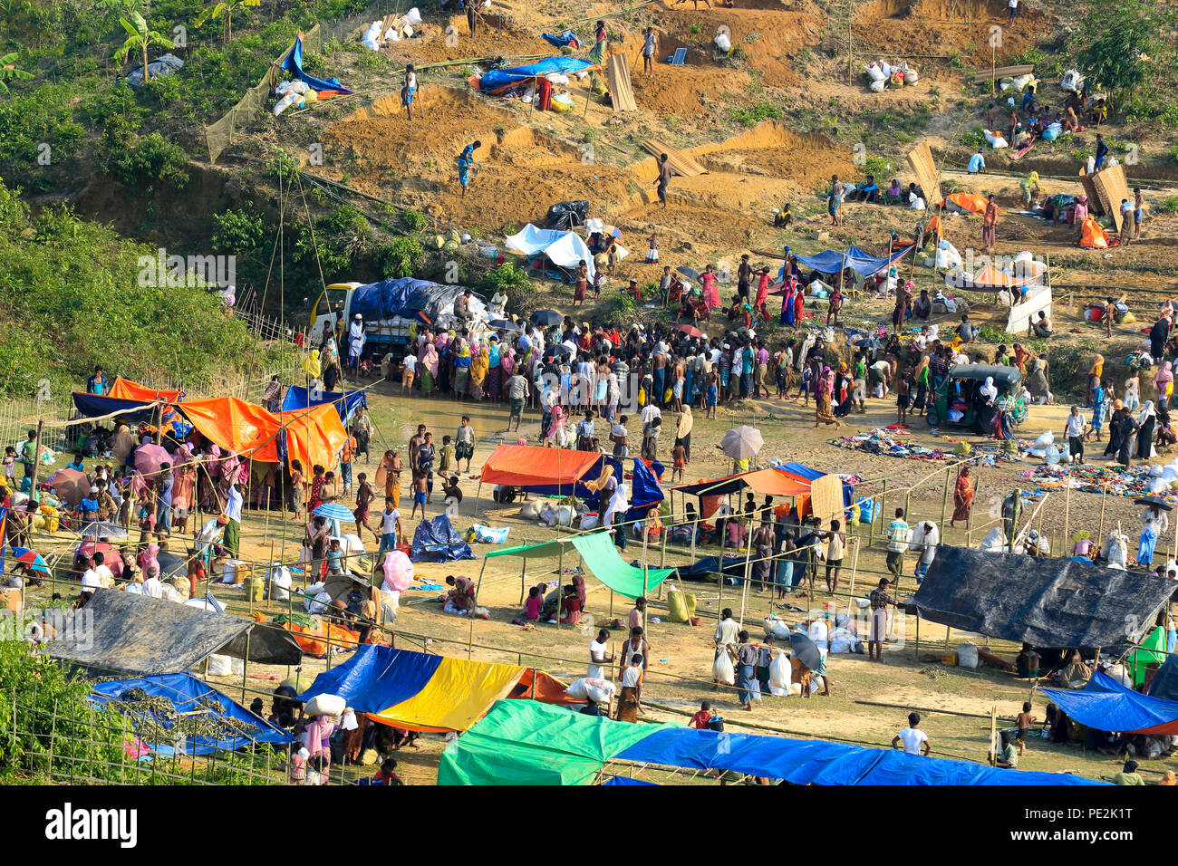Newly arrived Rohingya refugees are building new shelters by cutting ...