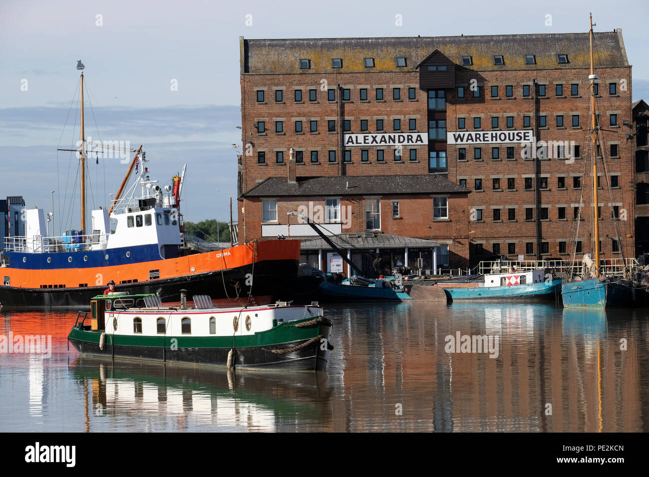 A narrow-beam Dutch barge style canal boat manoeuvring in the main ...